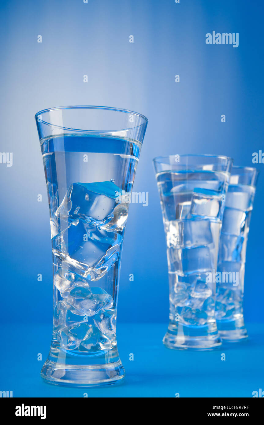 Water in the glass against gradient background Stock Photo - Alamy