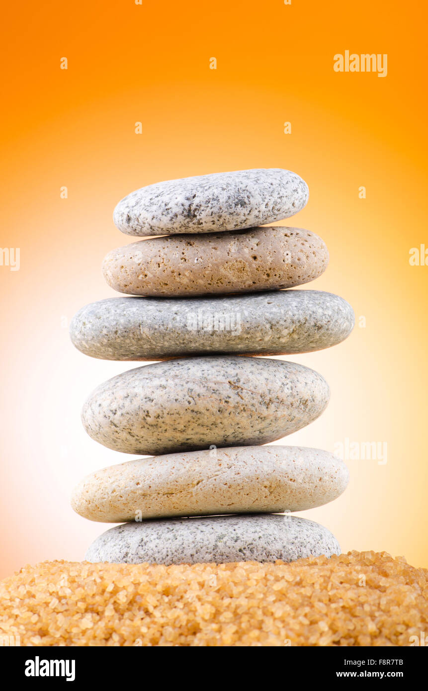 Balanced pebbles with colour background Stock Photo - Alamy