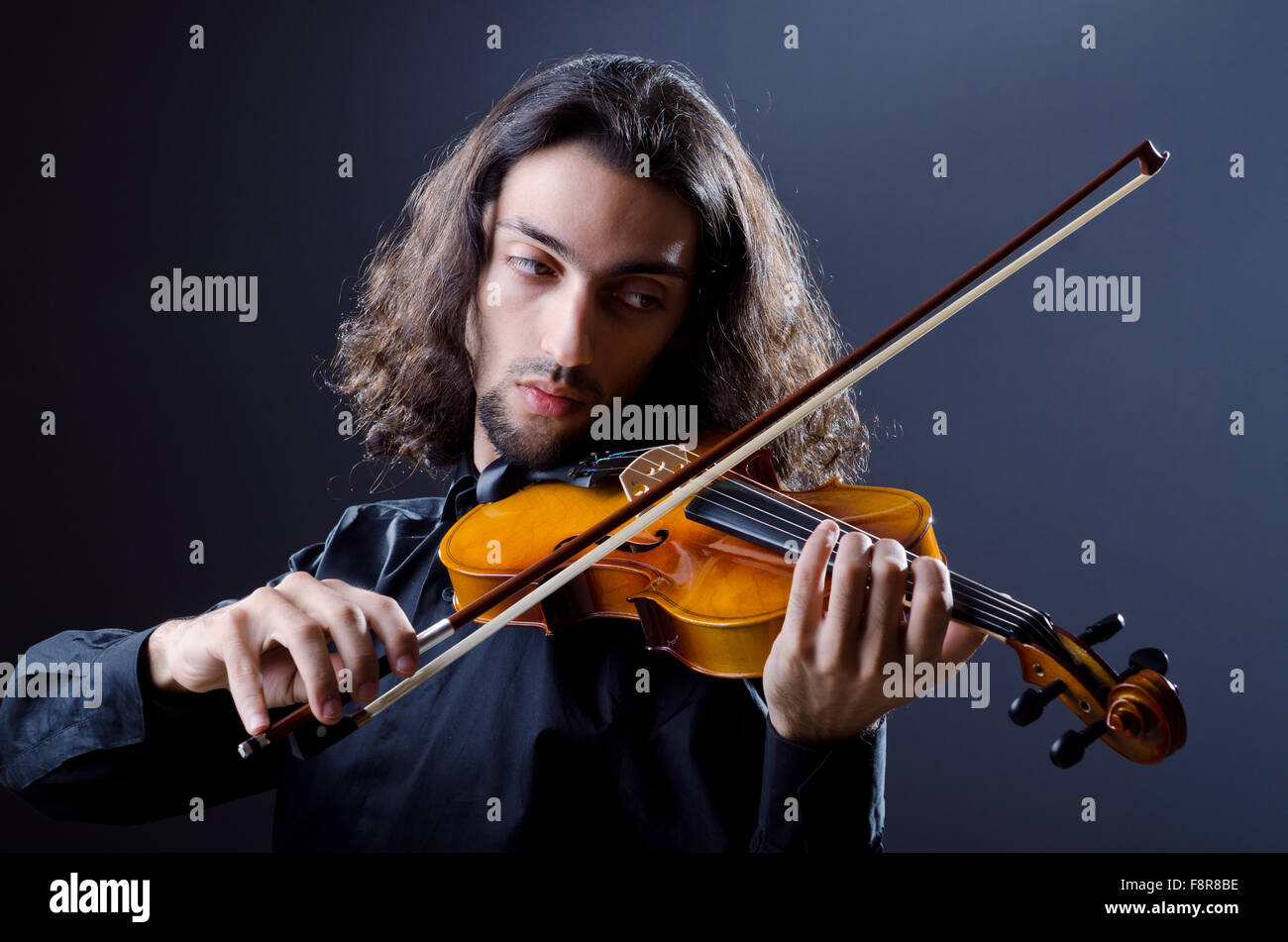 Young violin player playing Stock Photo - Alamy