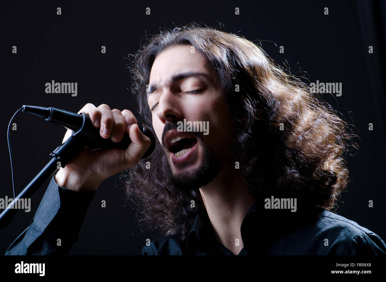Man singing at the concert Stock Photo - Alamy