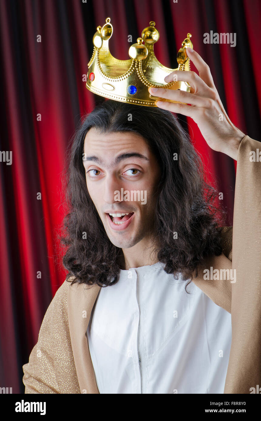 King with crown against background Stock Photo - Alamy