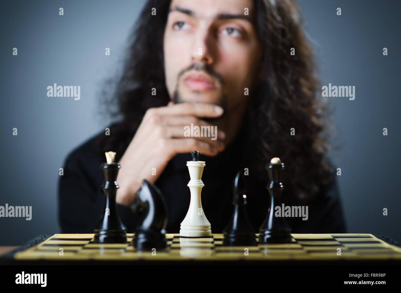 Chess player playing his game Stock Photo - Alamy