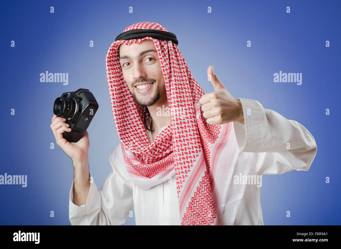 Arab photographer in studio shooting Stock Photo - Alamy