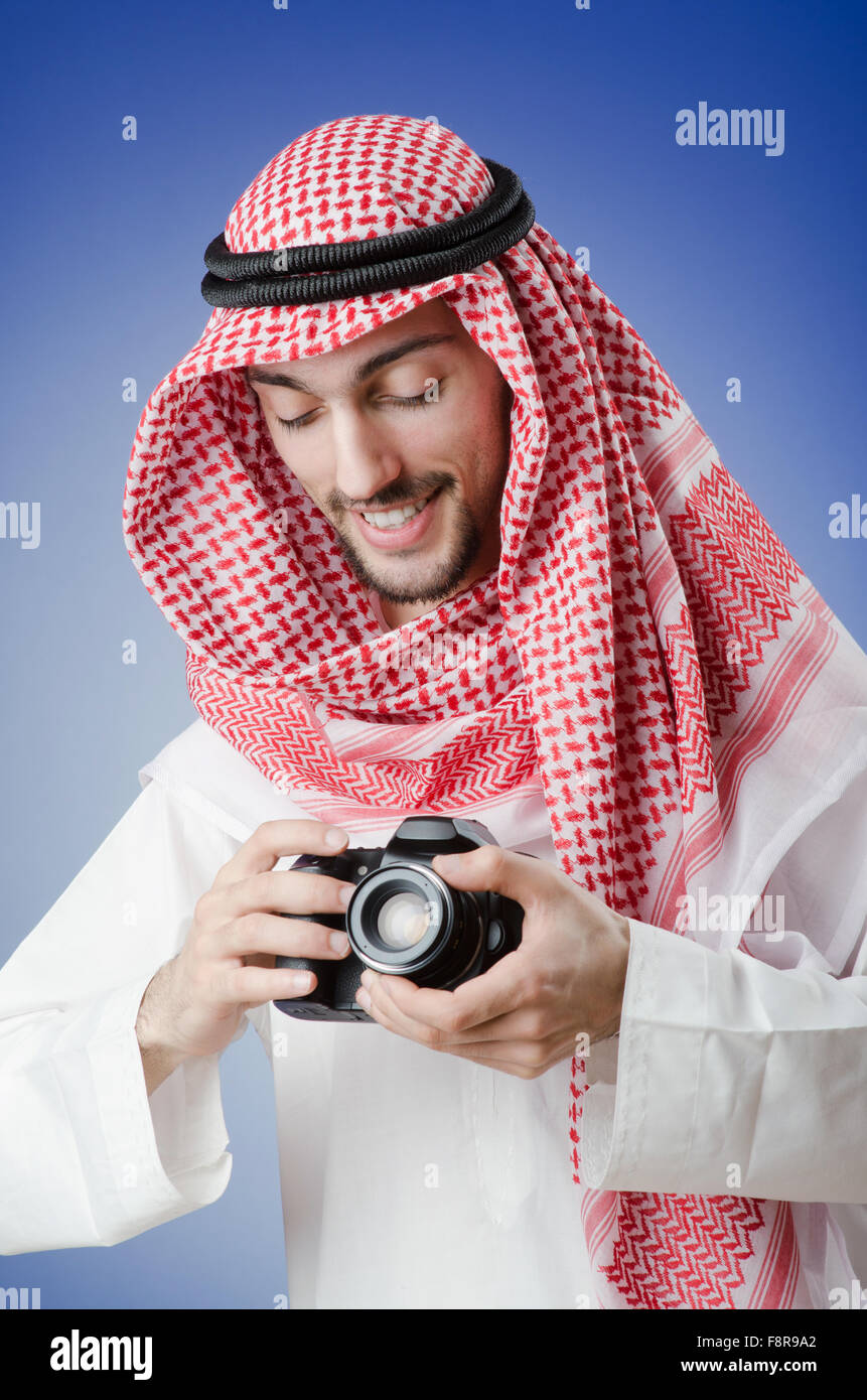 Arab photographer in studio shooting Stock Photo - Alamy