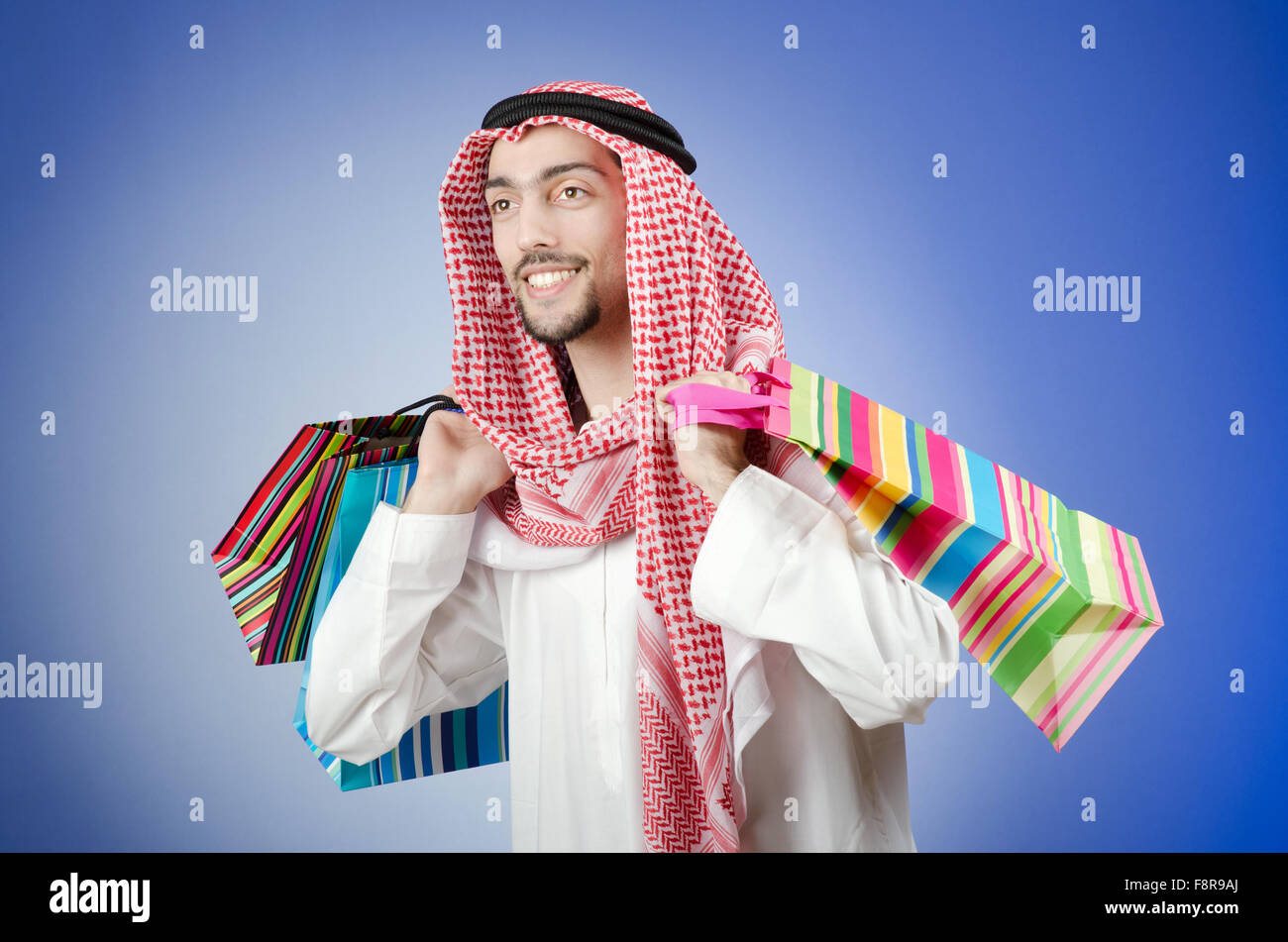 Arab with the gift bags Stock Photo - Alamy
