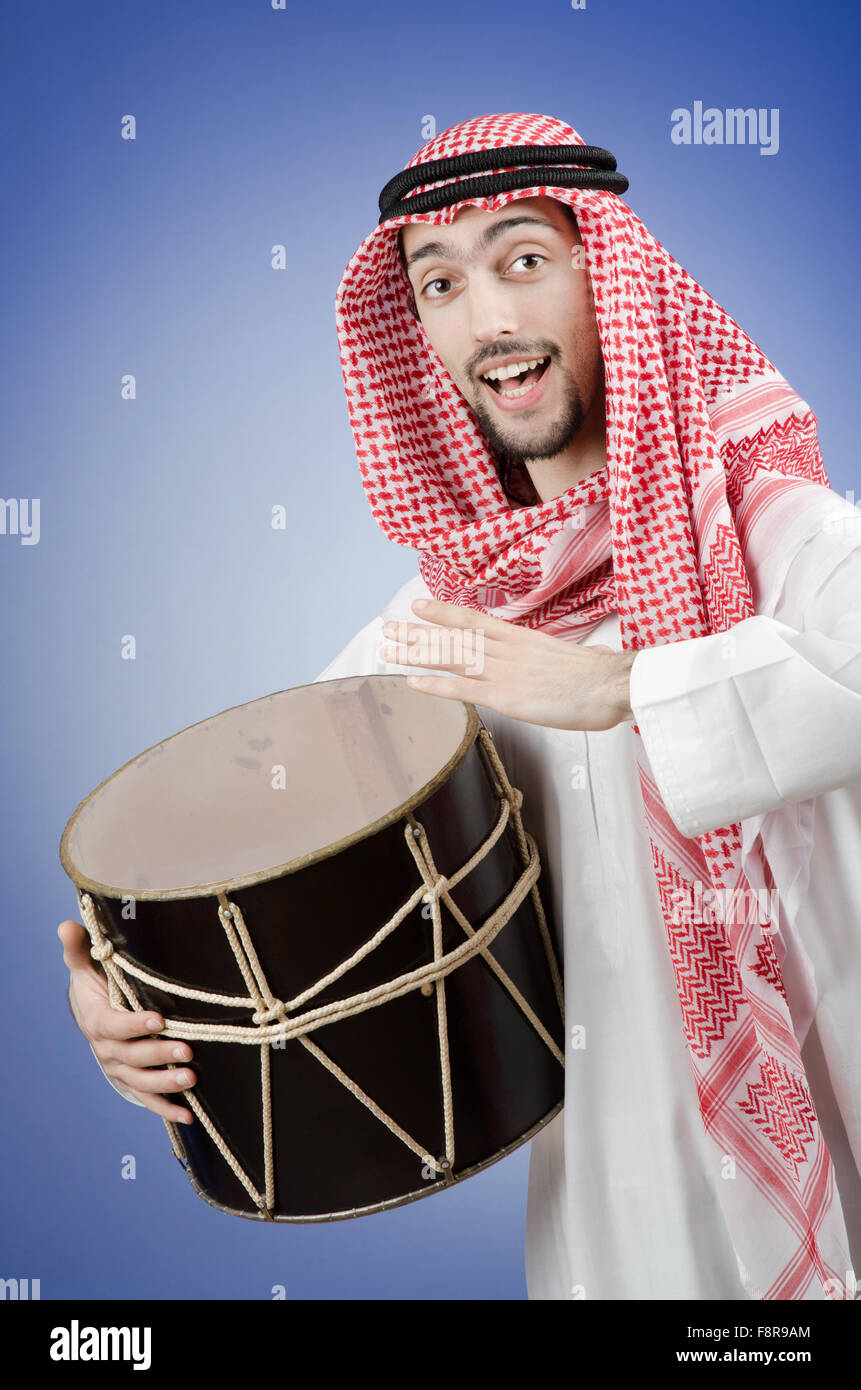 Arab playing drum in studio shooting Stock Photo - Alamy