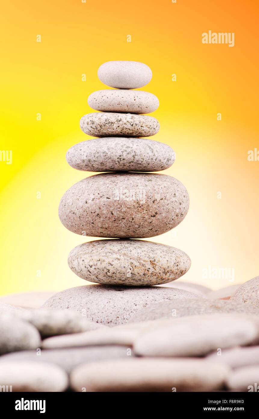 Pebbles stack against gradient background Stock Photo - Alamy