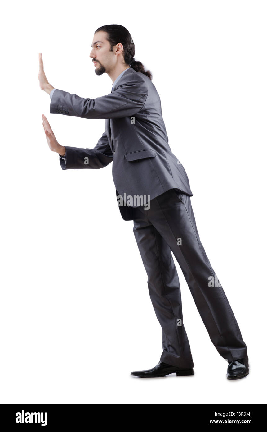 Businessman pushing away virtual obstacles Stock Photo - Alamy