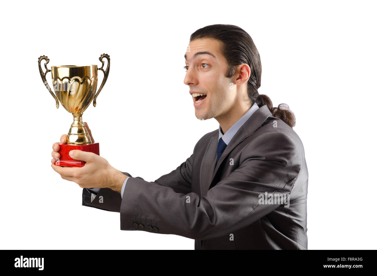 Golden trophy is being awarded to the winner hi-res stock photography ...