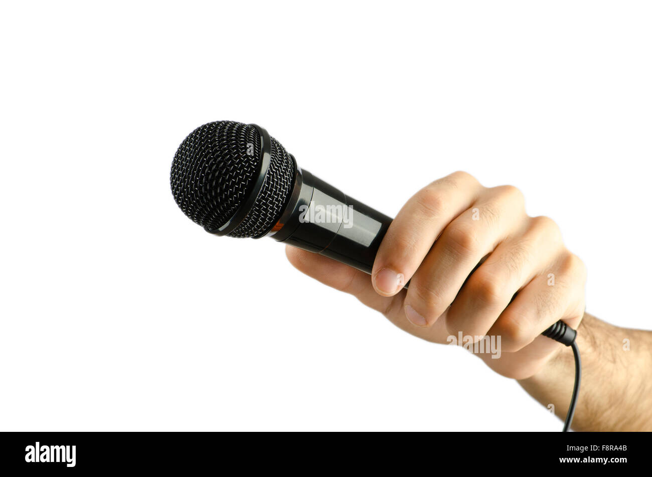 Hand holding microphone on white Stock Photo - Alamy