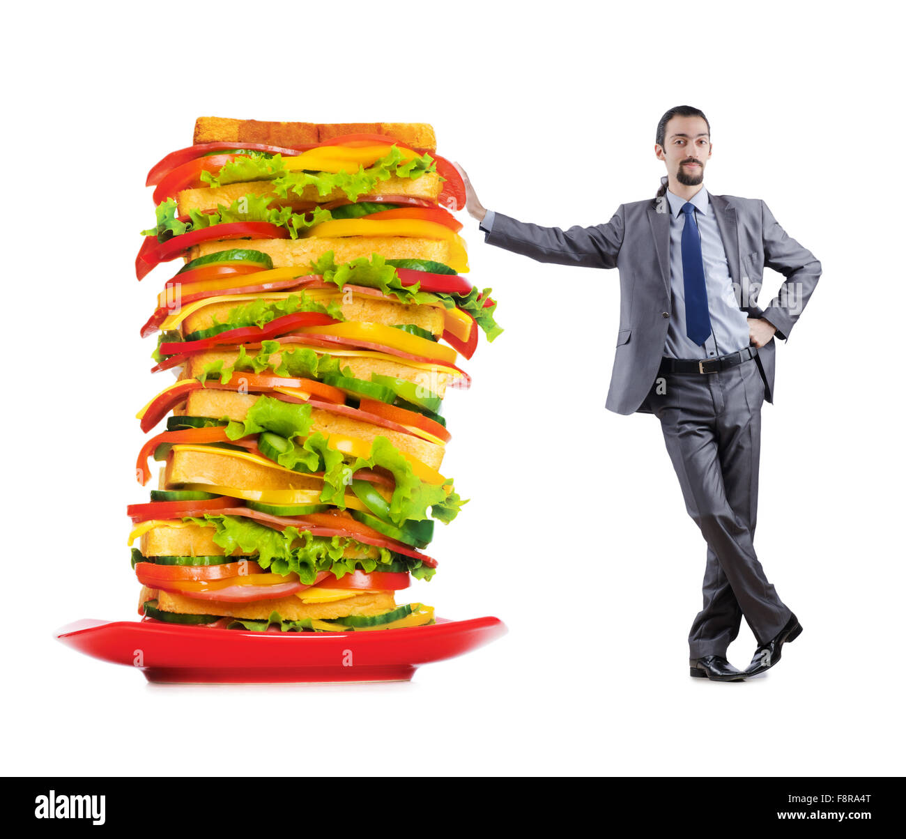 Man and giant sandwich on white Stock Photo - Alamy