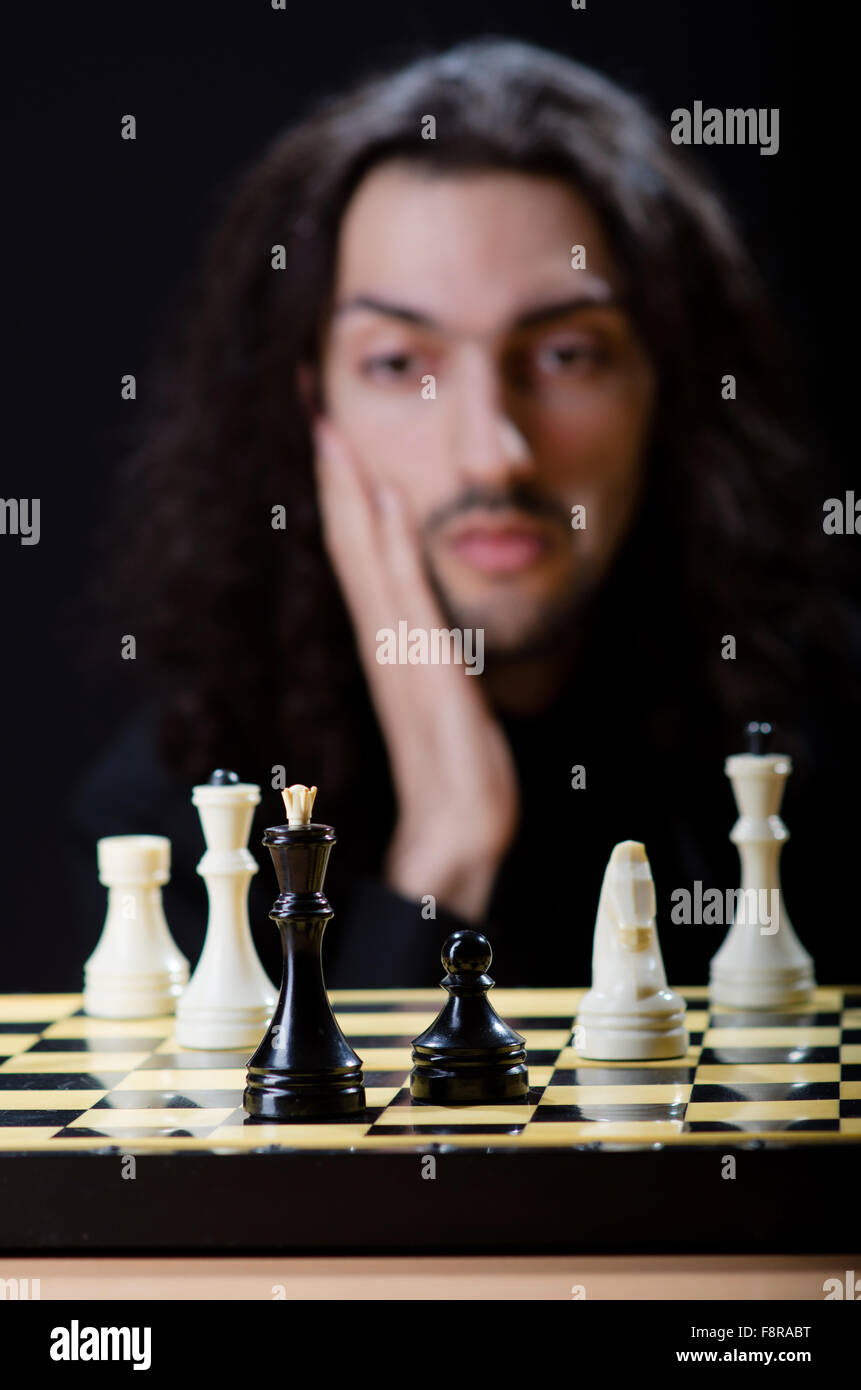 Chess player playing his game Stock Photo - Alamy