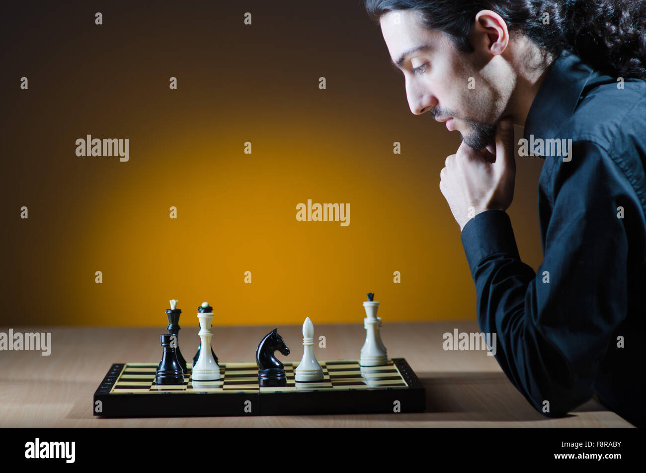Chess player playing his game Stock Photo - Alamy
