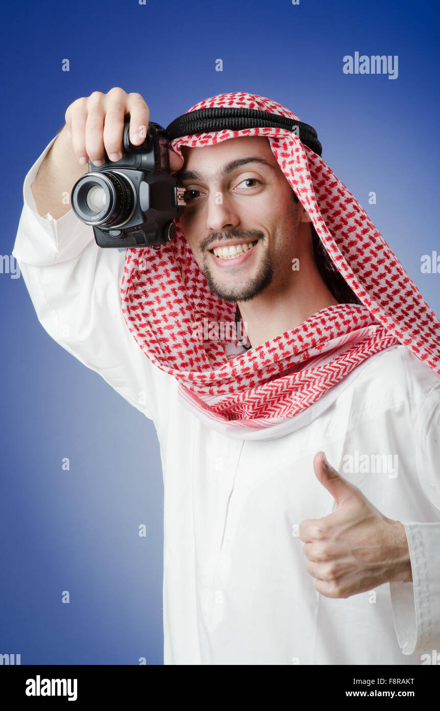 Arab photographer in studio shooting Stock Photo - Alamy