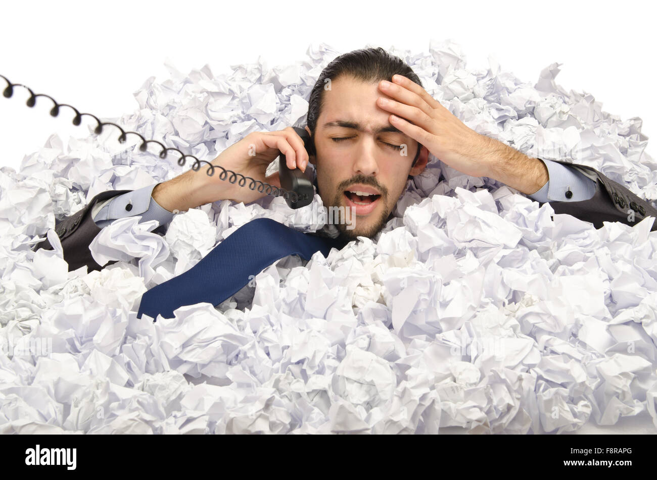Man with lots of crumpled paper Stock Photo - Alamy