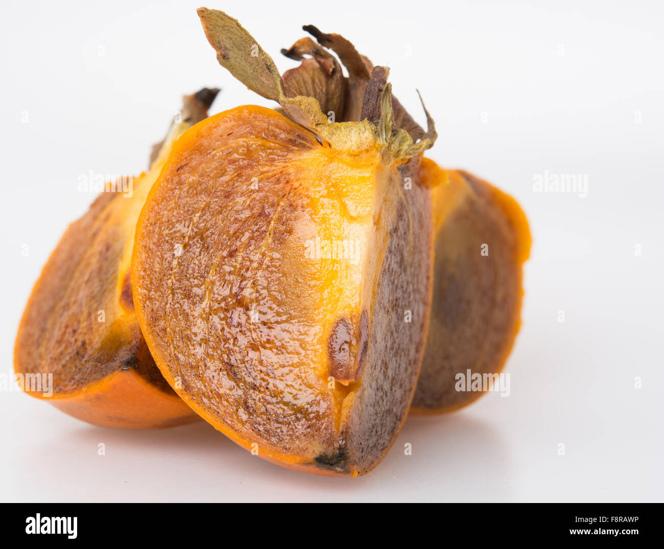 large slices of ripe persimmon Stock Photo - Alamy