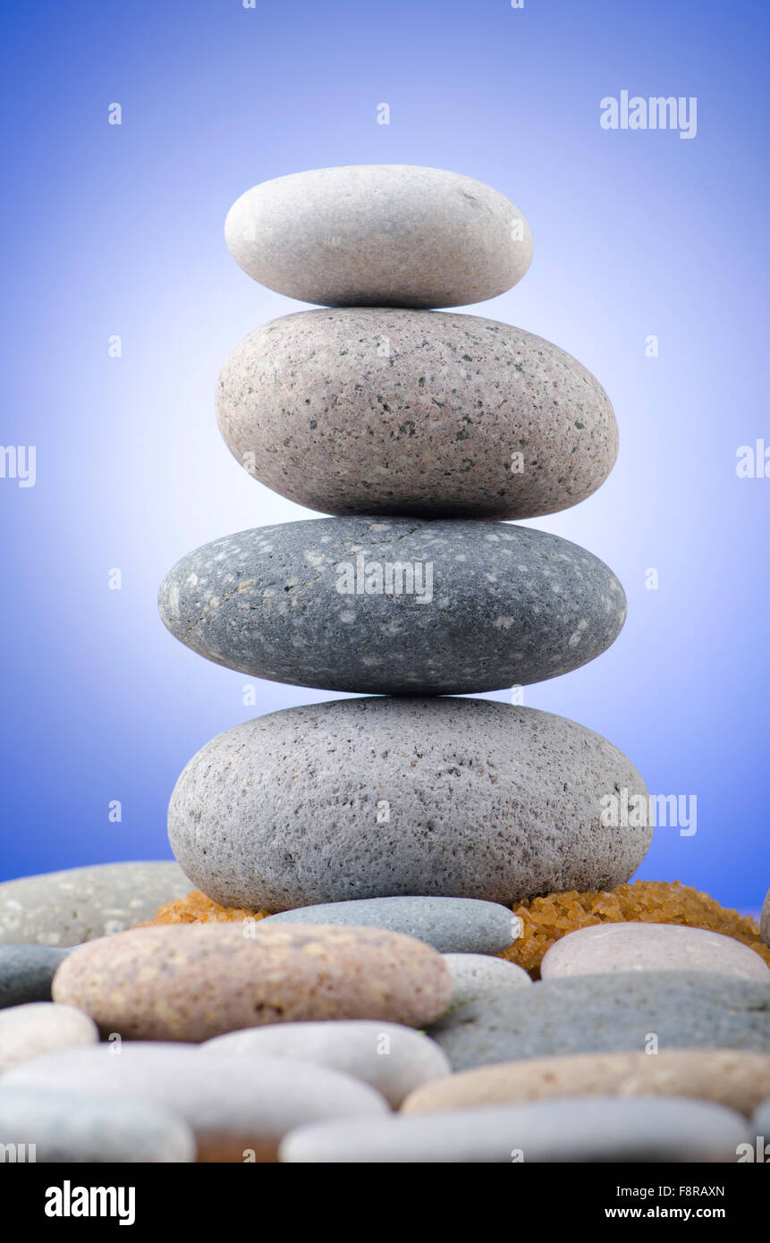 Balanced pebbles with colour background Stock Photo - Alamy
