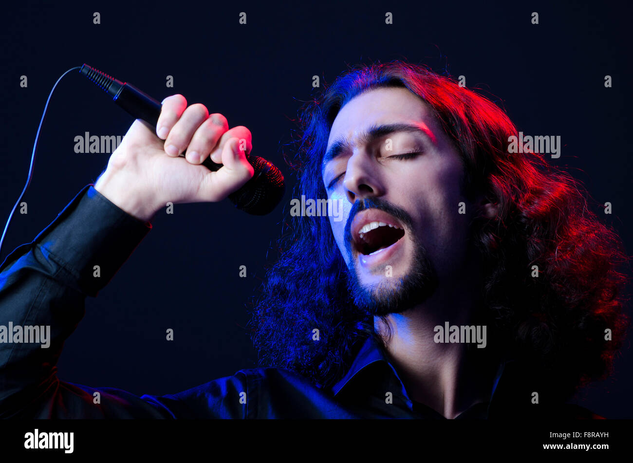 Man singing at the concert Stock Photo - Alamy