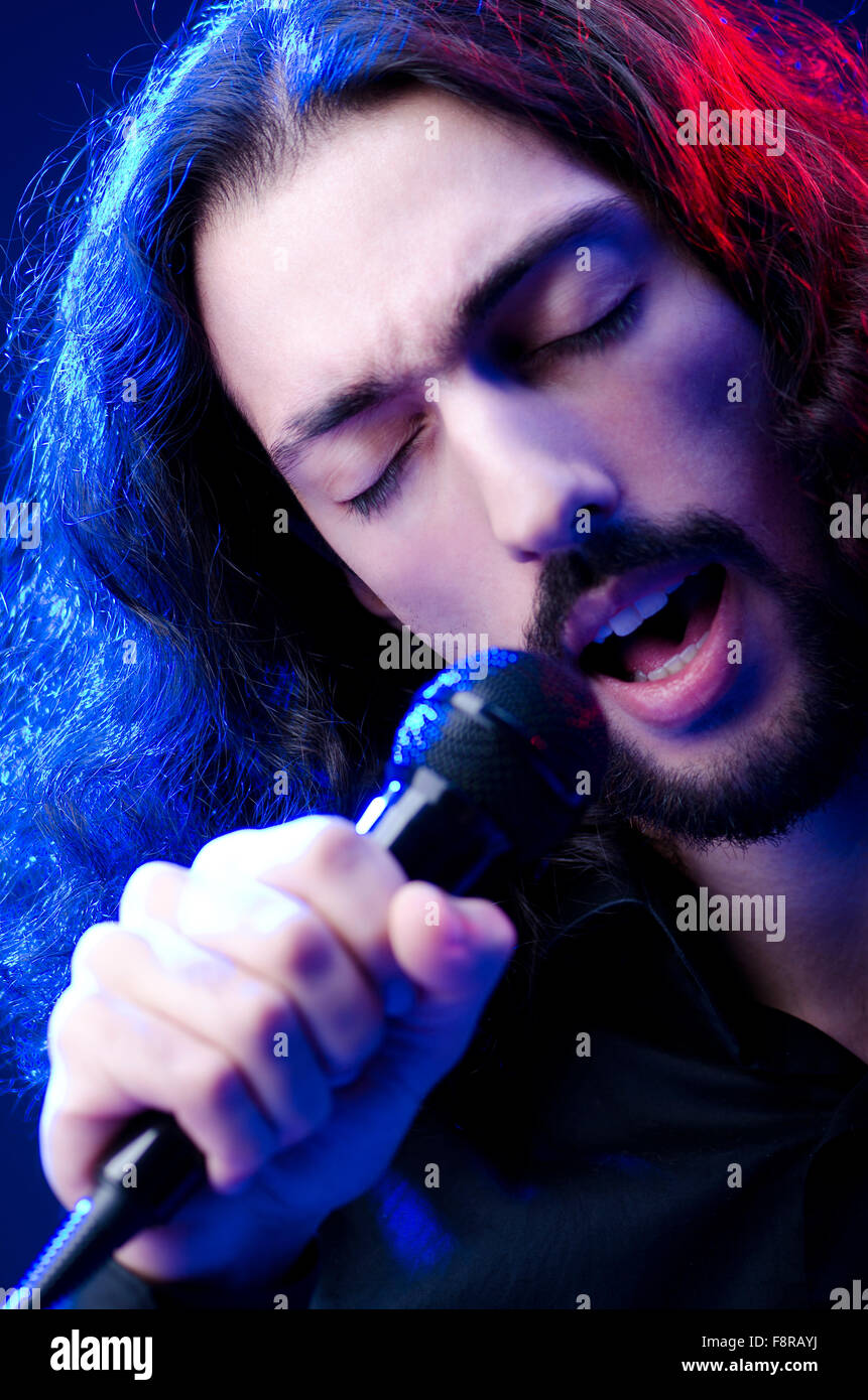 Man singing at the concert Stock Photo - Alamy