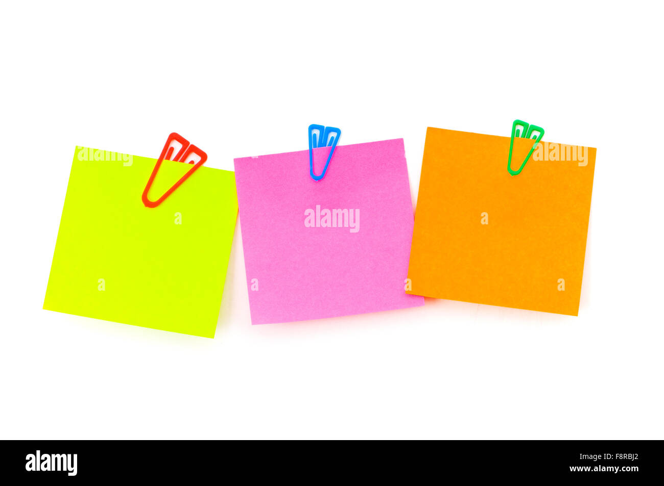 Three notes with paper clips on the white board Stock Photo - Alamy