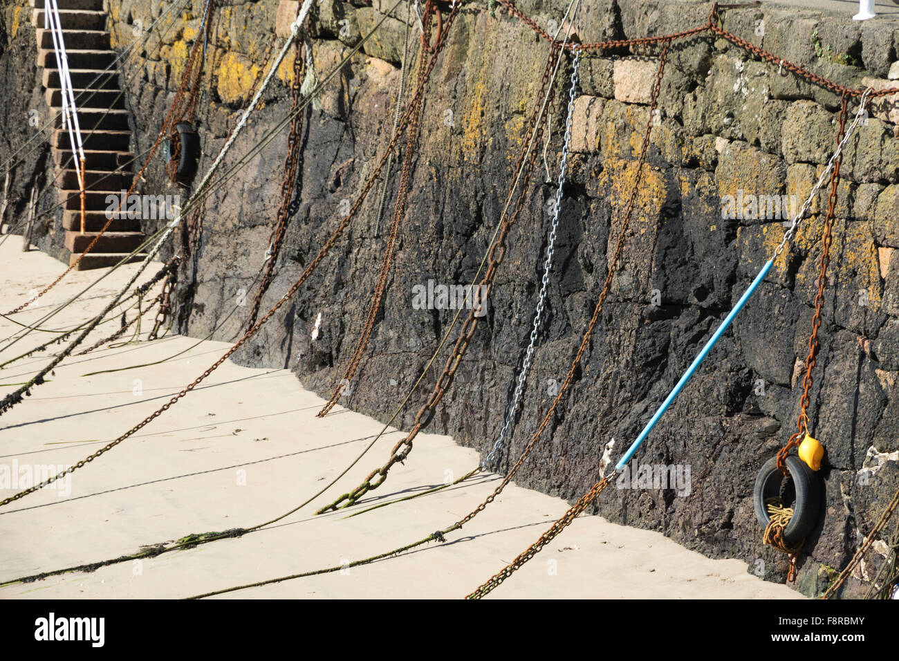 Mooring chains attached to Rozel Harbour pier on Jersey Stock Photo - Alamy