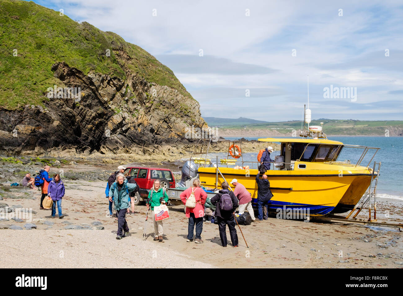 Tourists returning from Bardsey Island / Ynys Enlli boat trip. Porth ...