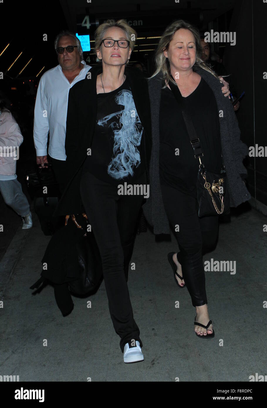 Sharon Stone wearing a black t-shirt with 'Where There Is Smoke, There ...