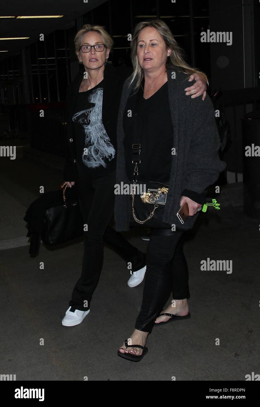 Sharon Stone wearing a black t-shirt with 'Where There Is Smoke, There ...