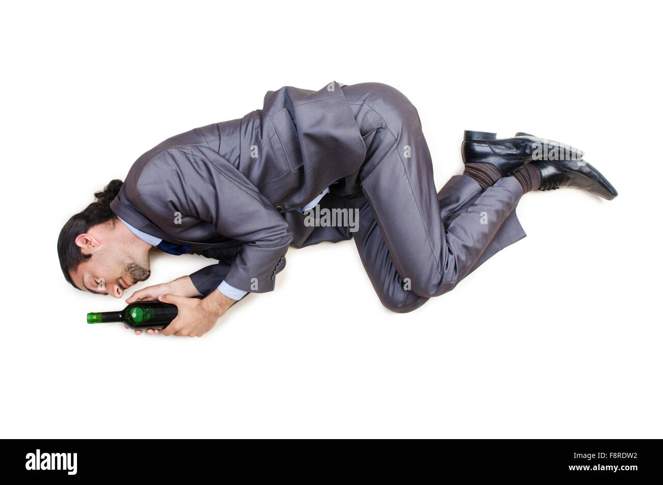 Drunk man lying on ground hi-res stock photography and images - Alamy