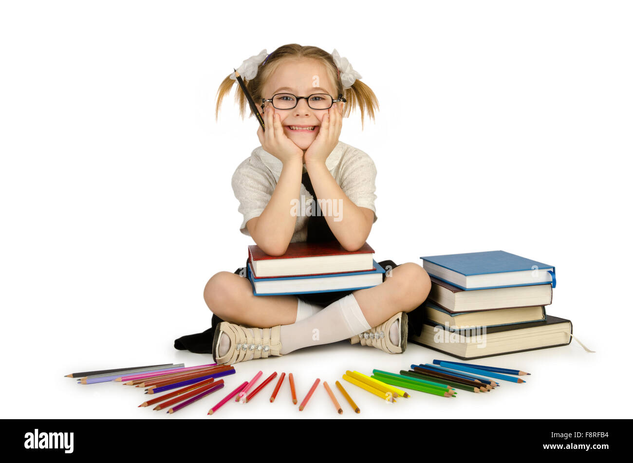 Little girl with books on white Stock Photo - Alamy
