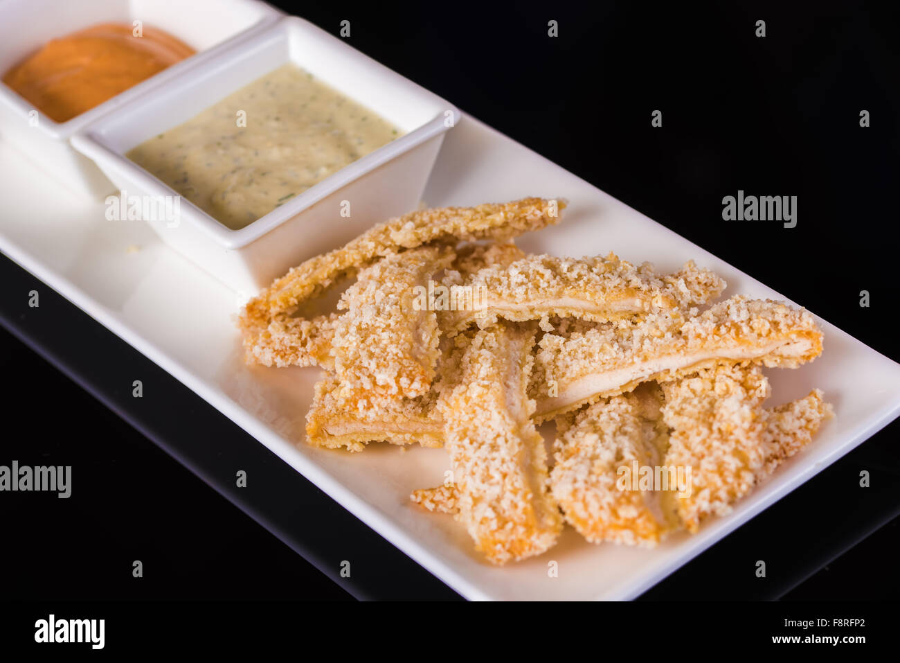 Fish fillets with sauces Stock Photo - Alamy