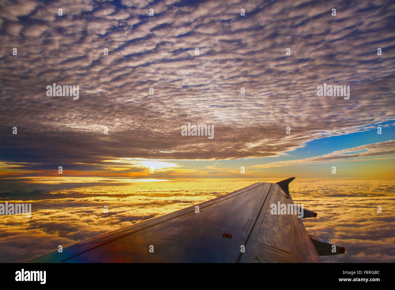 Airplane wing at sunset Stock Photo - Alamy