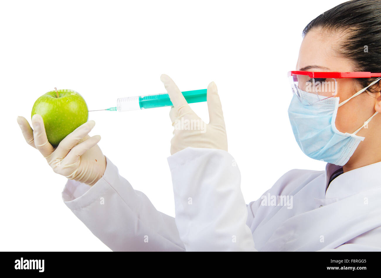 Chemical experiment with apple and syringe Stock Photo - Alamy