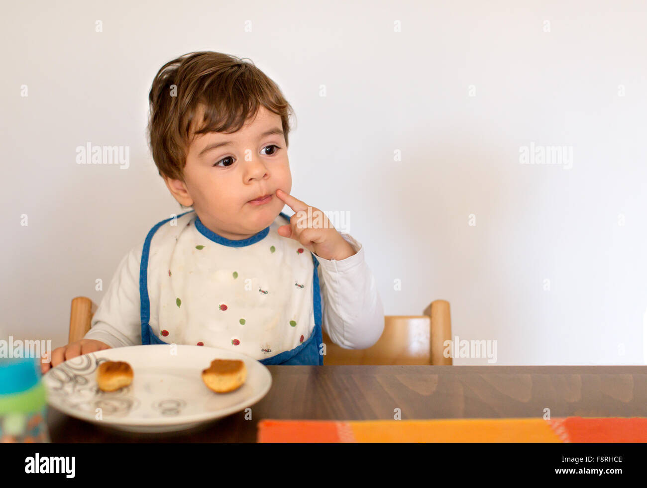 Boy sitting and eating hi-res stock photography and images - Alamy