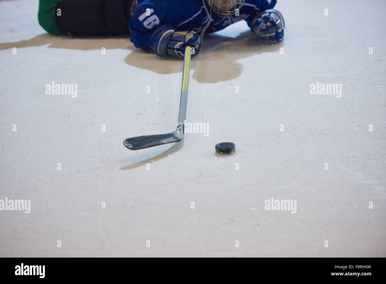 ice hockey player in action kicking with stick Stock Photo - Alamy
