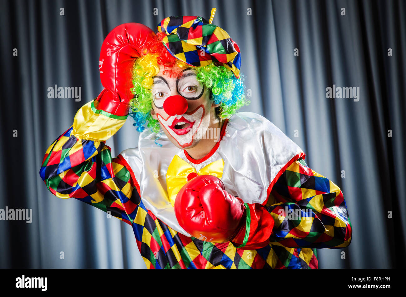 Funny clown in the studio shooting Stock Photo - Alamy