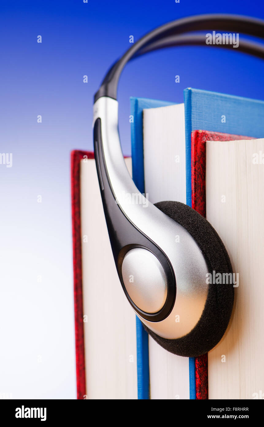 Concept of audio books with earphones on white Stock Photo - Alamy