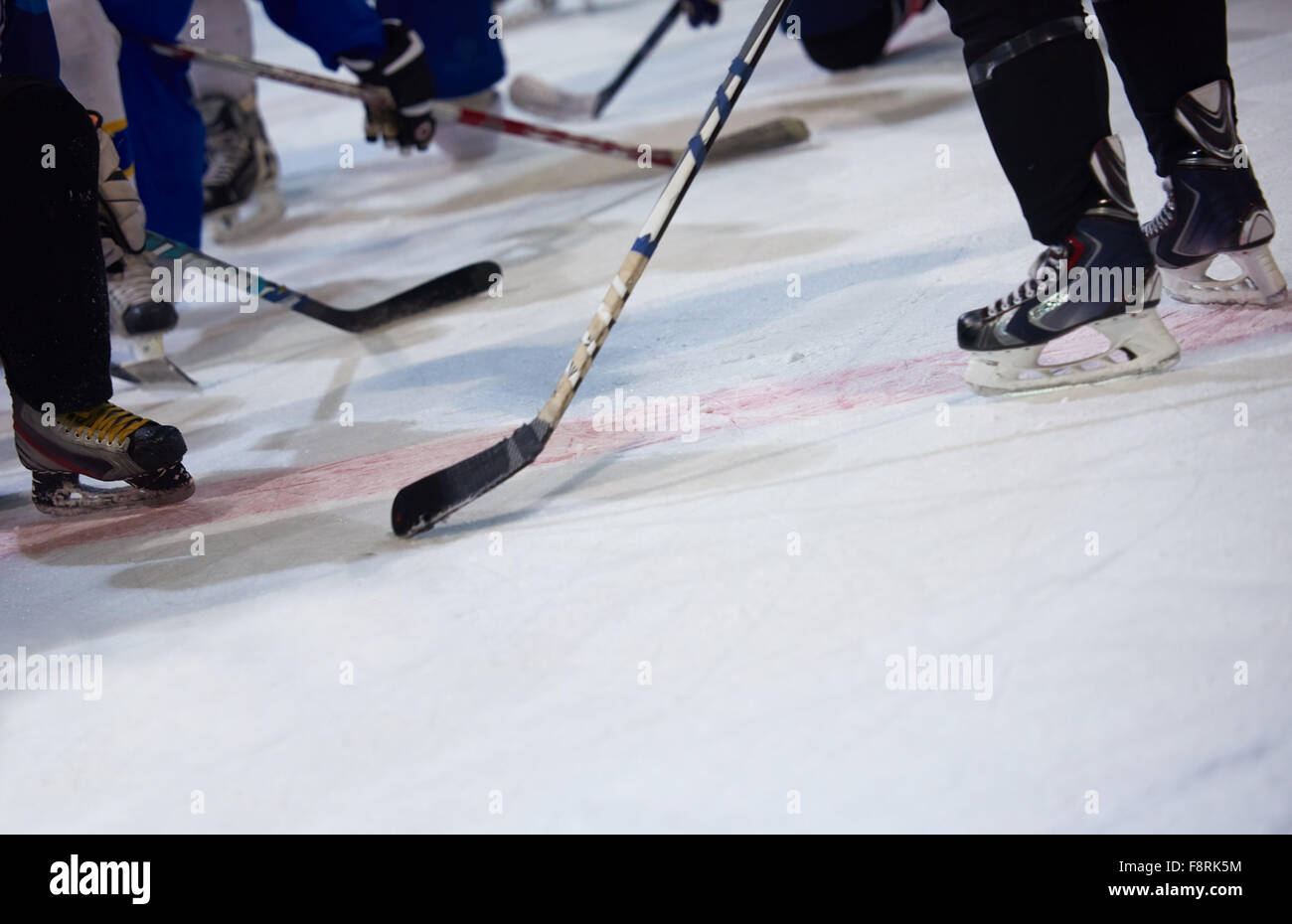 ice hockey player in action kicking with stick Stock Photo - Alamy