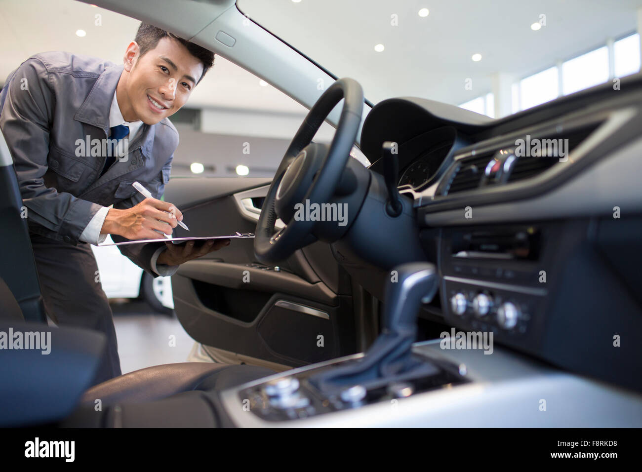 Mechanic standing repairing steering hi-res stock photography and ...