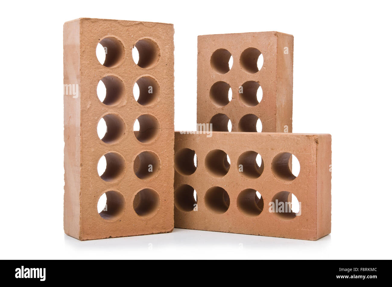 Stack of clay bricks isolated on white Stock Photo - Alamy