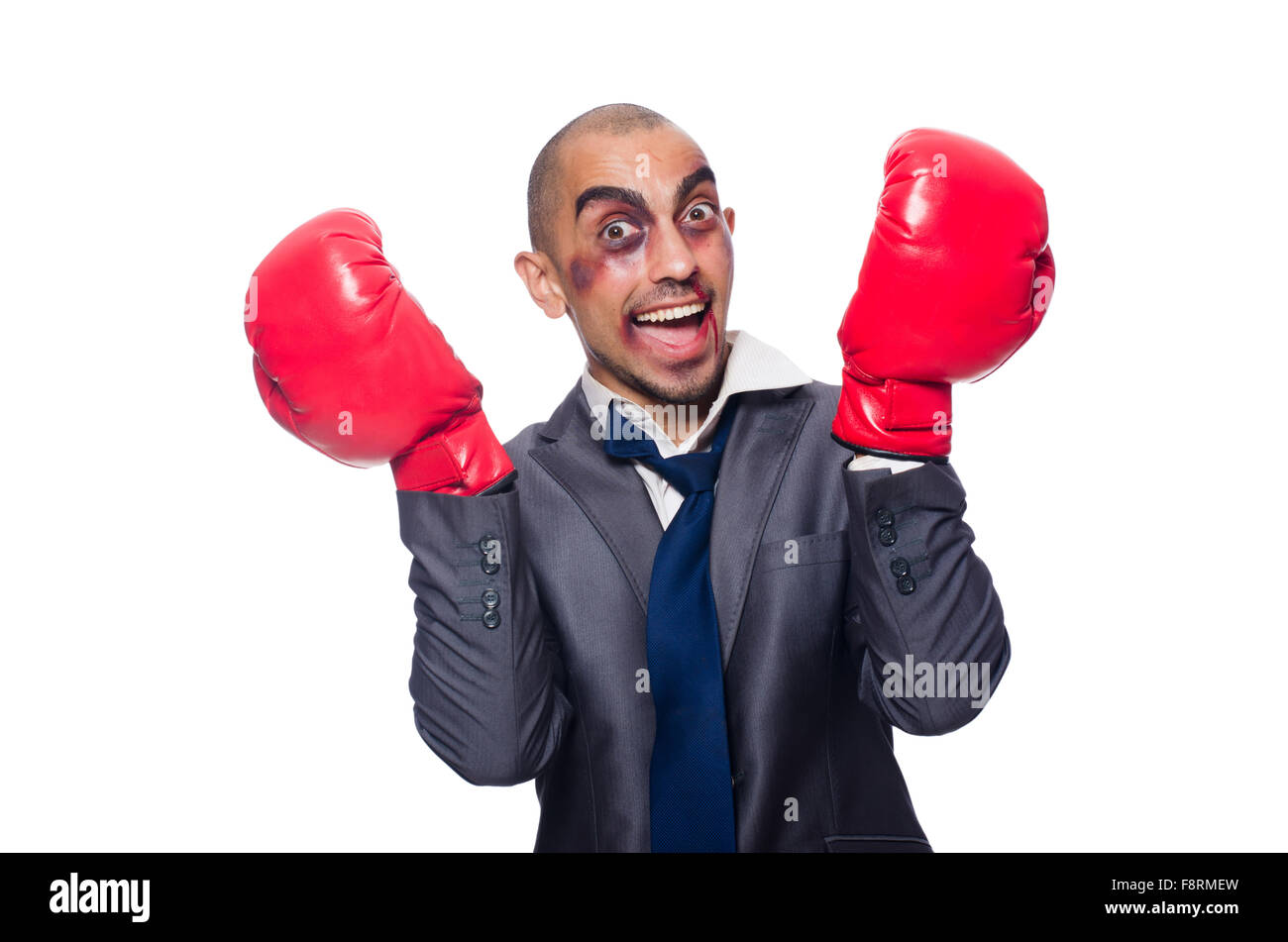 Badly beaten businessman with boxing gloves Stock Photo - Alamy