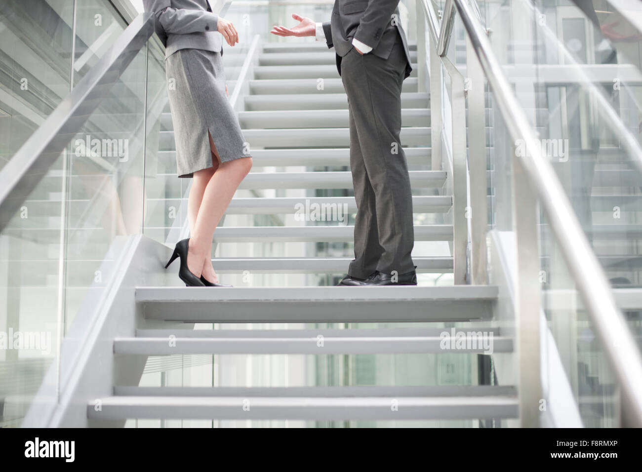 Business person talking on the stairs Stock Photo - Alamy