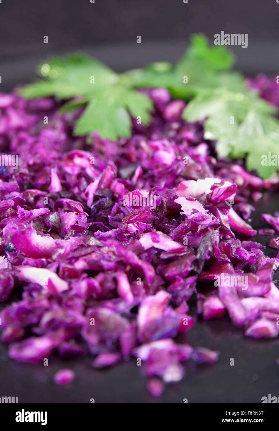 Finely chopped red cabbage with parsley leaves Stock Photo - Alamy