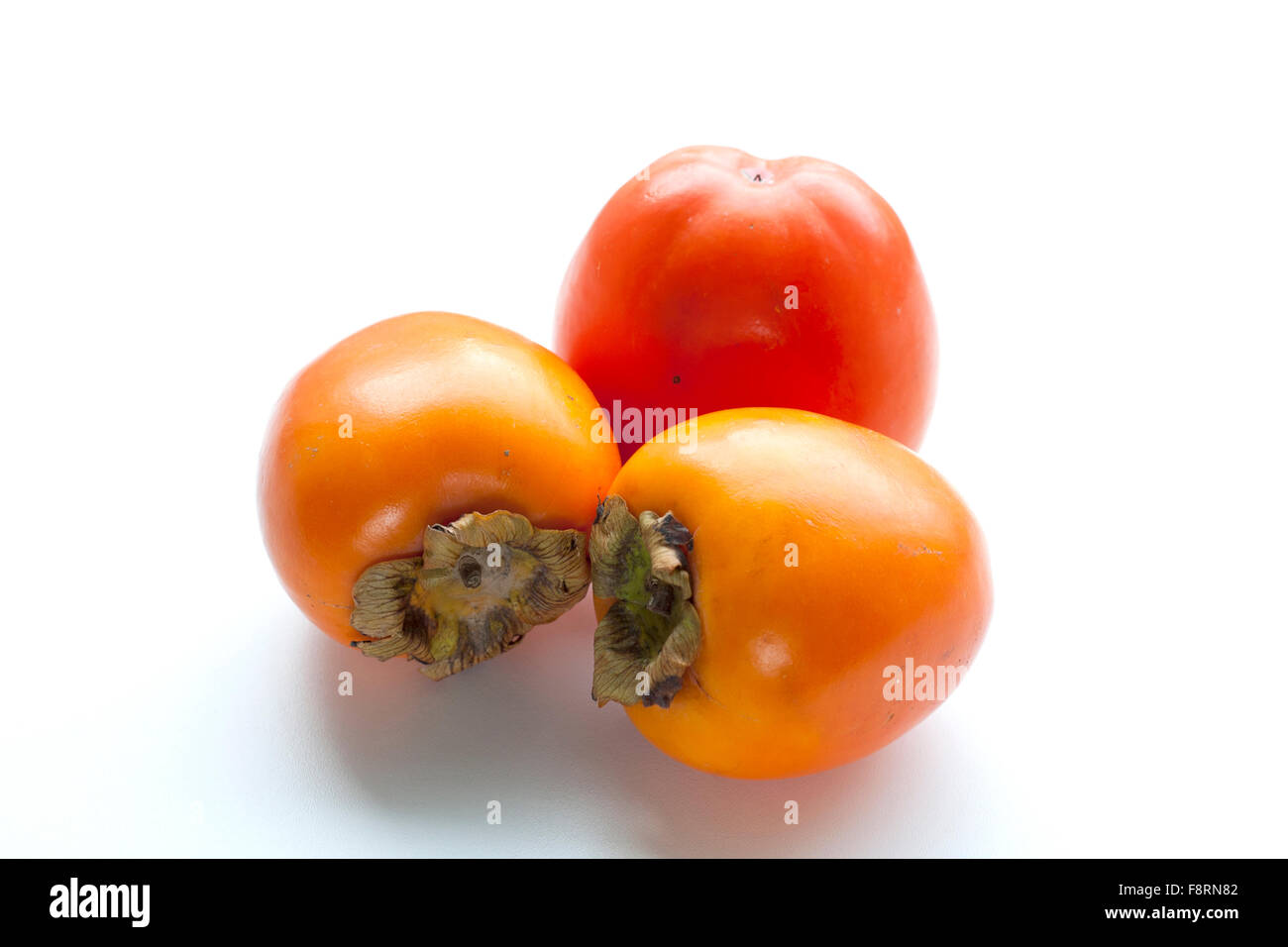 Ripe persimmon with cut isolated on white background. Clipping Path ...