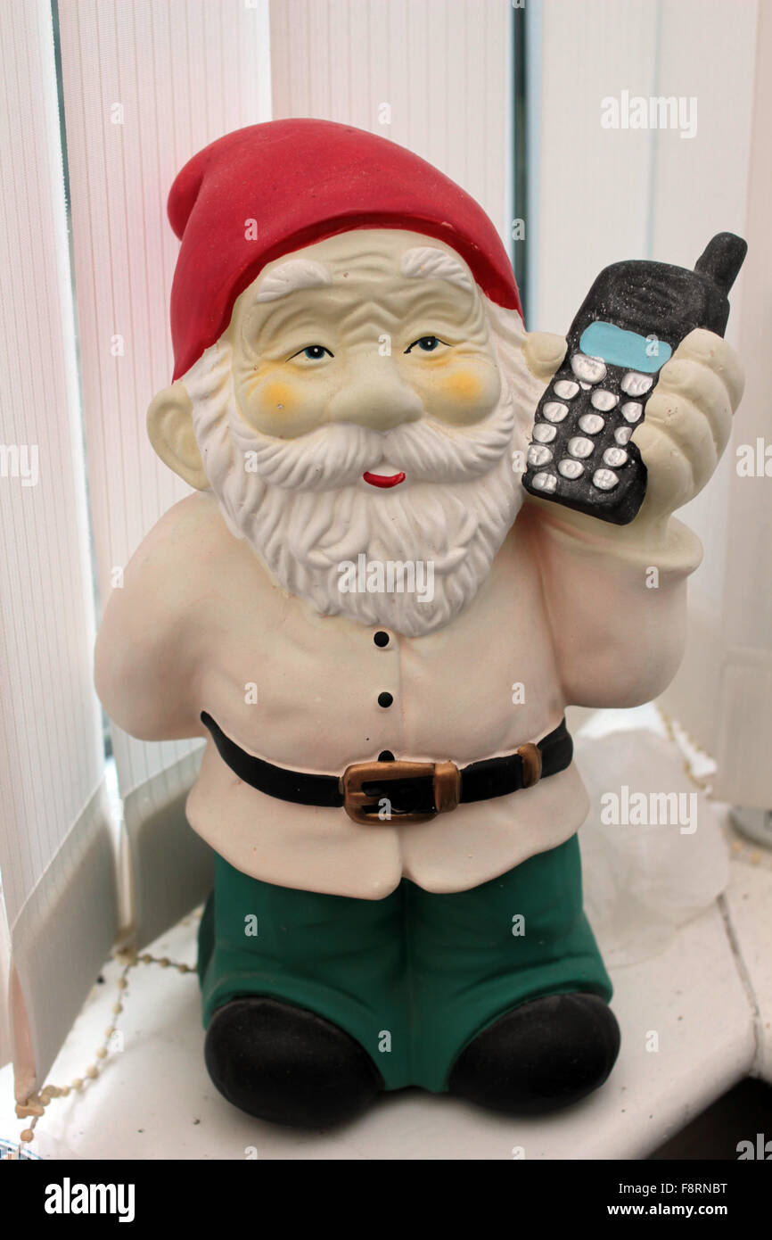 Gnome with a telephone Stock Photo - Alamy