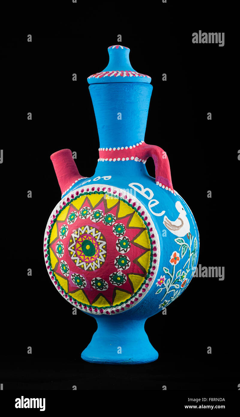 Egyptian painted pottery jug on black background Stock Photo - Alamy