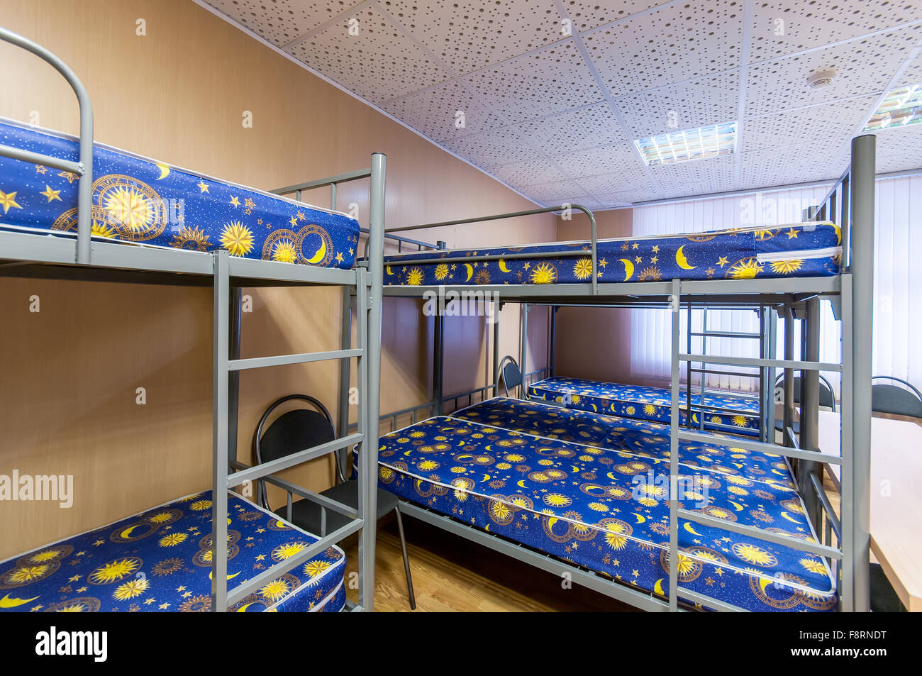 bunk metal beds in clean hostel room Stock Photo - Alamy