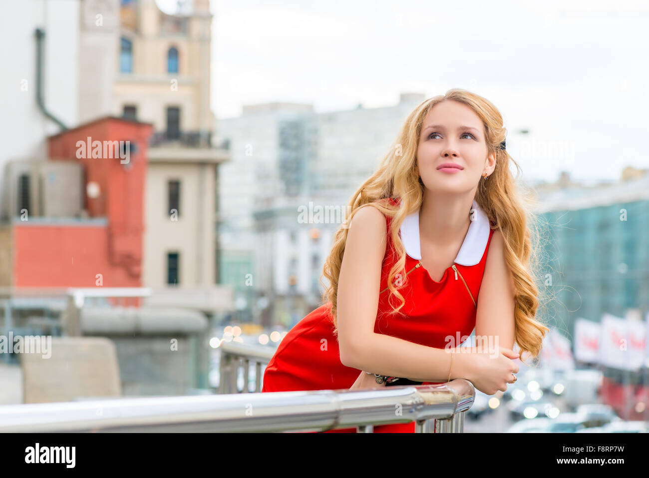 Beautiful model leaning against railing hi-res stock photography and ...