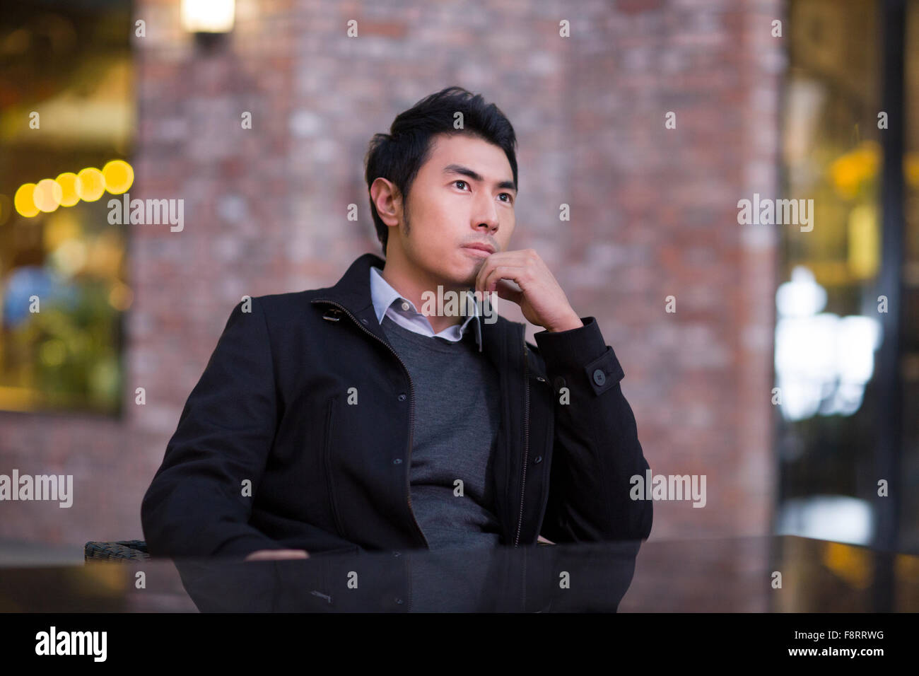 Young man looking at view Stock Photo - Alamy