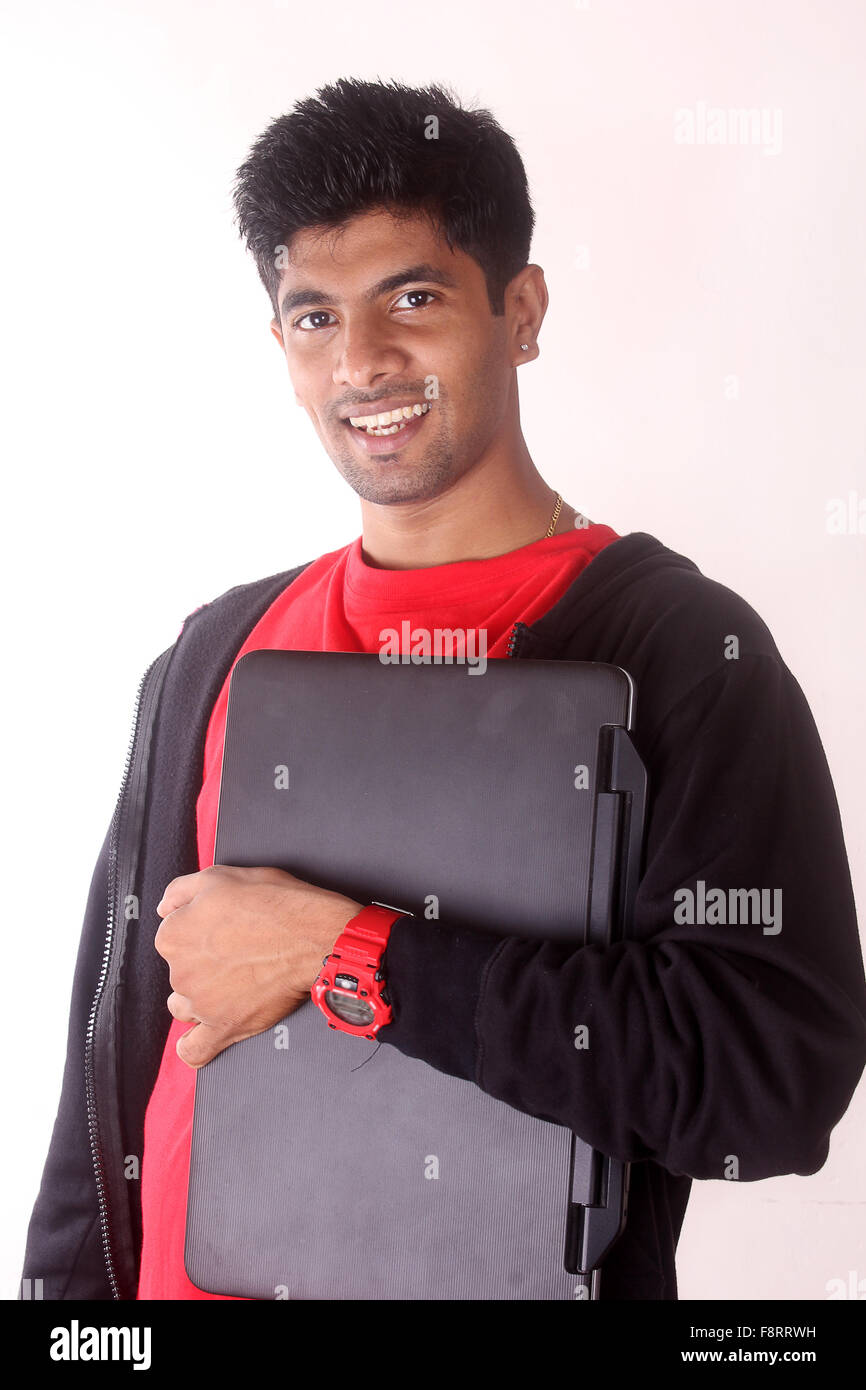 Happy student holding laptop.Isolated on white background Stock Photo ...